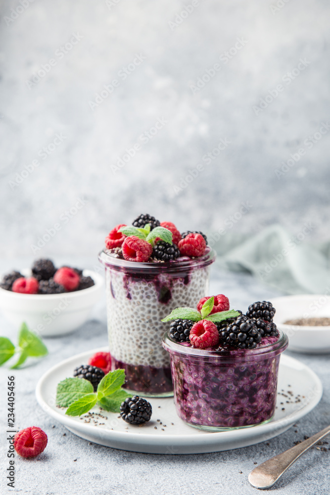 chia seeds pudding with berry sauce and fresh raspberry and blackberry ...