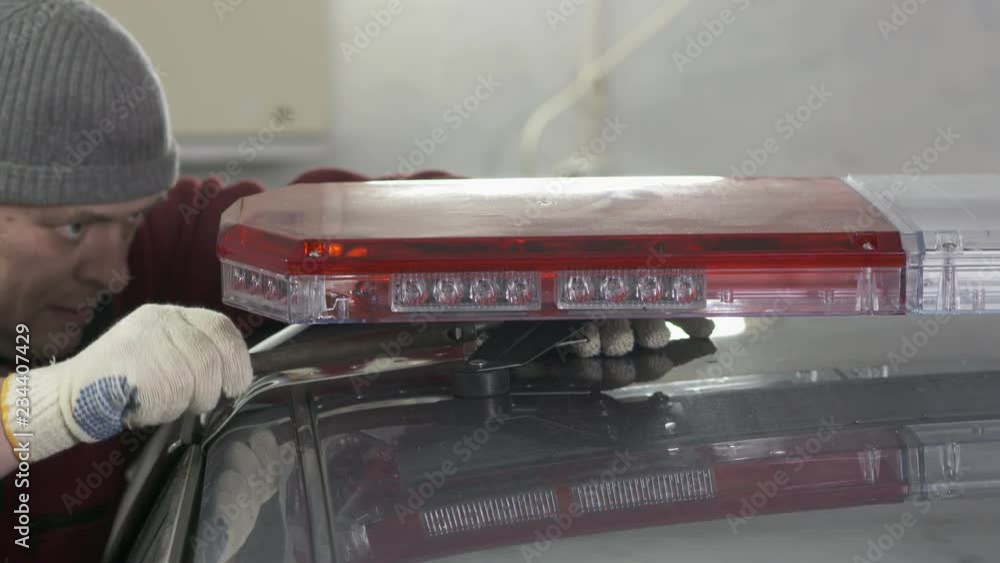 Emergency vehicle lighting installation. Mounting police red blue ...