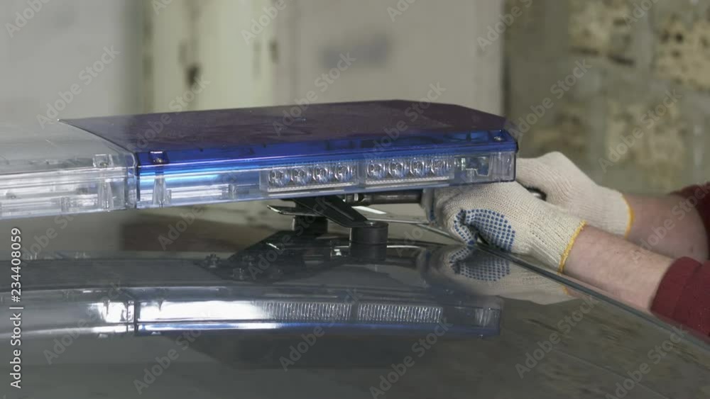 Emergency vehicle lighting installation. Mounting police red blue ...