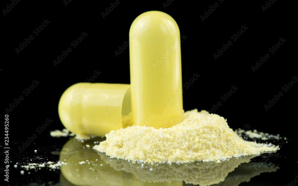 Contents of antibiotic capsules, yellow powder and salt crystals Photos ...