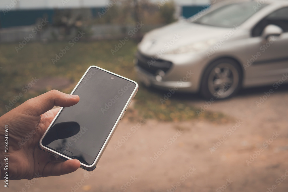 Person connects with smart car by phone application. Mobile app ...