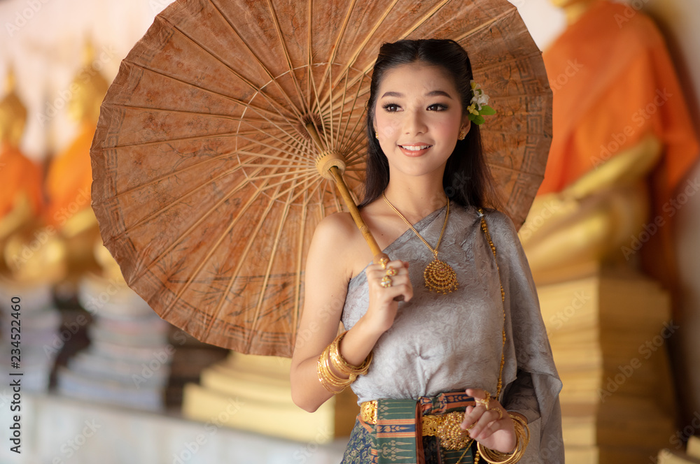 Thailand or Thai costume Asian dress concept. Young Thai beautiful ...