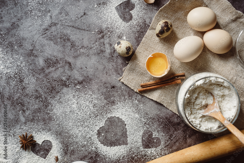 Healthy baking ingredients. Background with flour, rolling pin, eggs ...