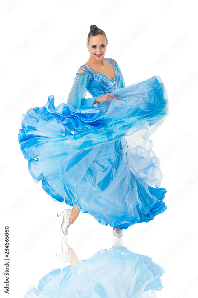Girl on smiling face dressed in luxury blue dress posing with posture ...