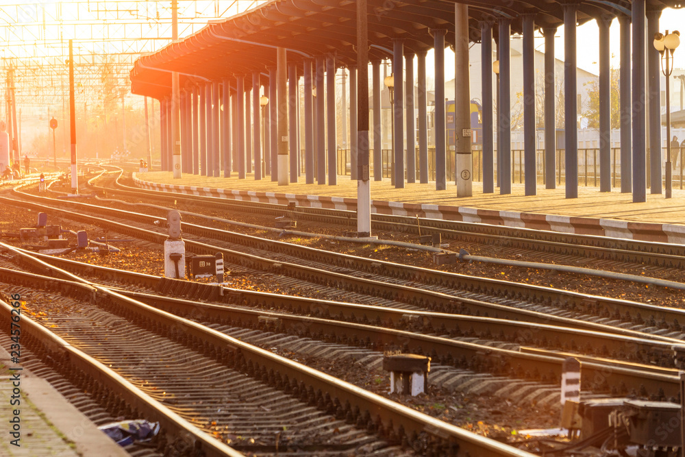 railway tracks with a view to an empty stop, for a travel concept or a ...
