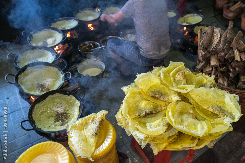 Banh xeo, Vietnamese traditional street food yellow crispy rice flour ...