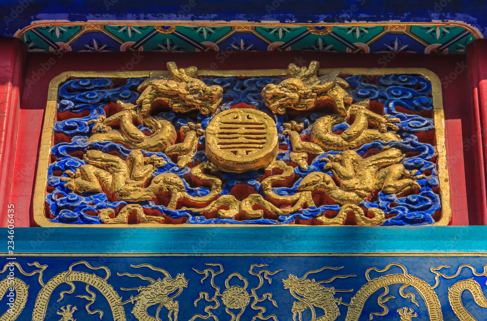 Ornate carved and painted beam and rafters with traditional Chinese ...