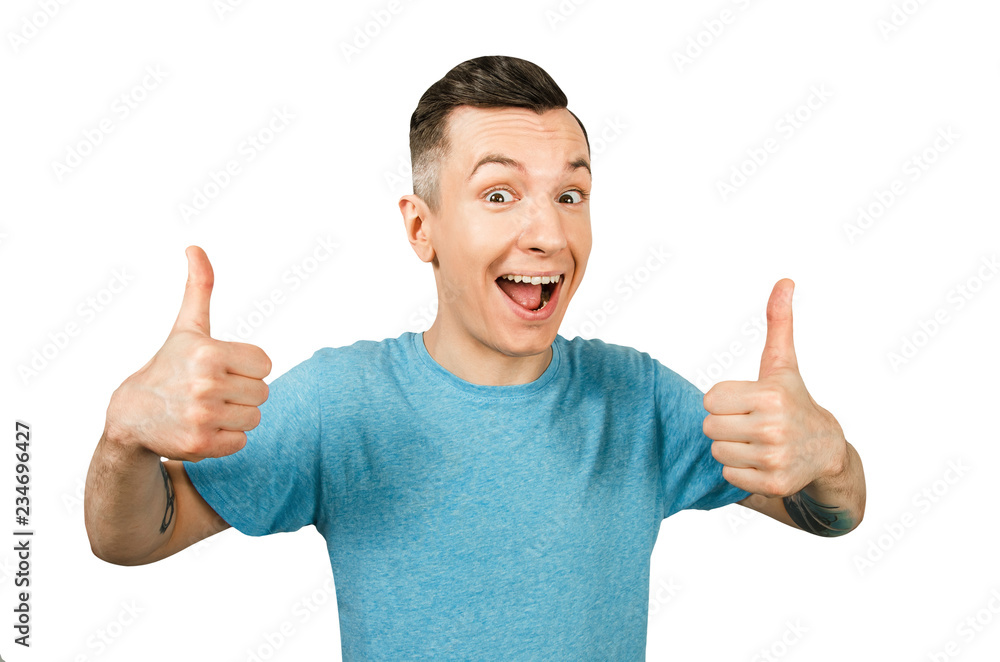 Portrait of young smiling guy showing thumbs up isolated on a white background. Stock-Foto ...