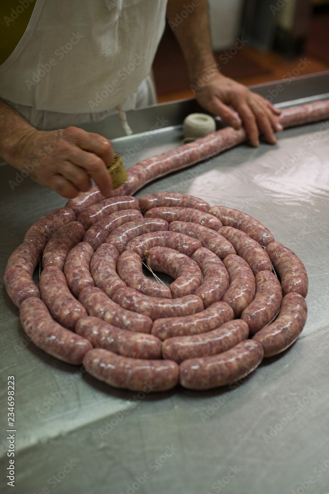 Making the sausage Stock Photo | Adobe Stock
