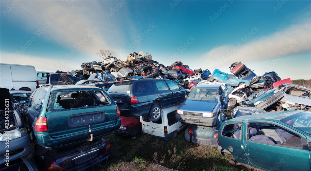 pile of broken cars on scrapyard blue sky Stock Photo | Adobe Stock
