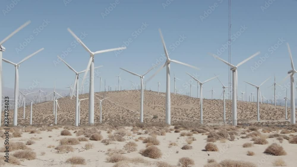 Stockvideo Wind farm desert landscape with wind turbines producing ...