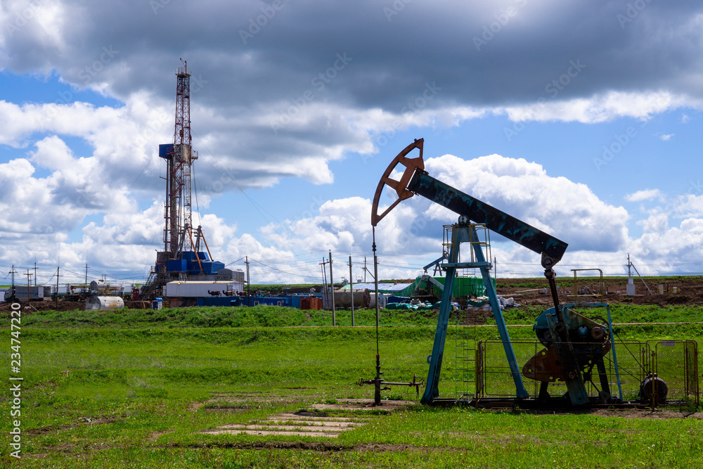 The beam pumping unit is homework, sunset in oil field. Oil pump oil ...