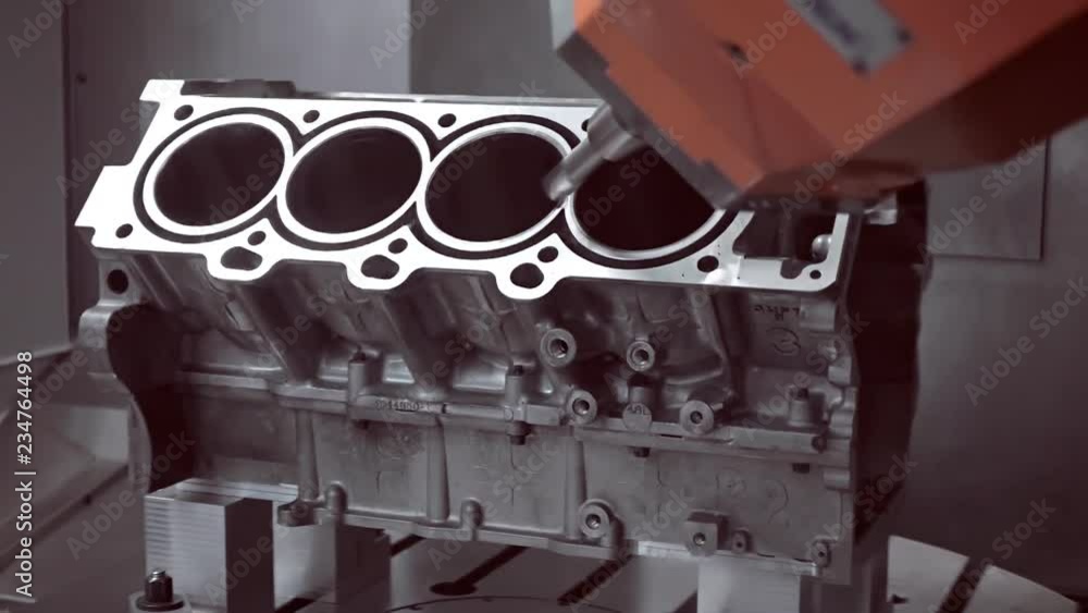 The robot's arm on the program performs the milling of the cylinder ...