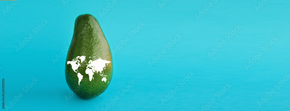 Green ripe avocado with a world map to illustrate a healthy lifestyle ...