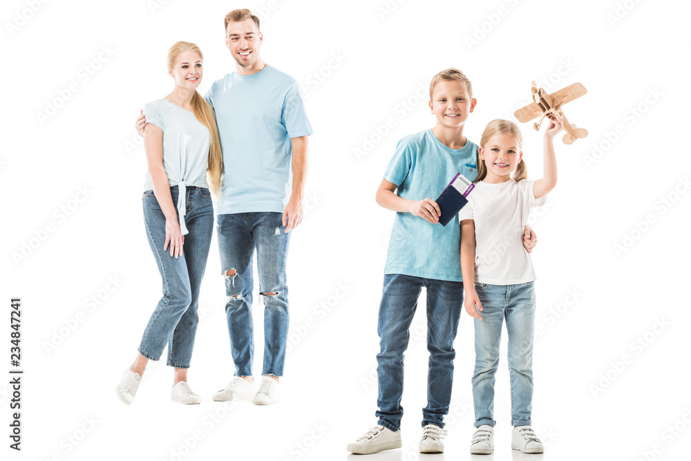 Happy parents looking at kids and smiling isolated on white Stock Photo ...