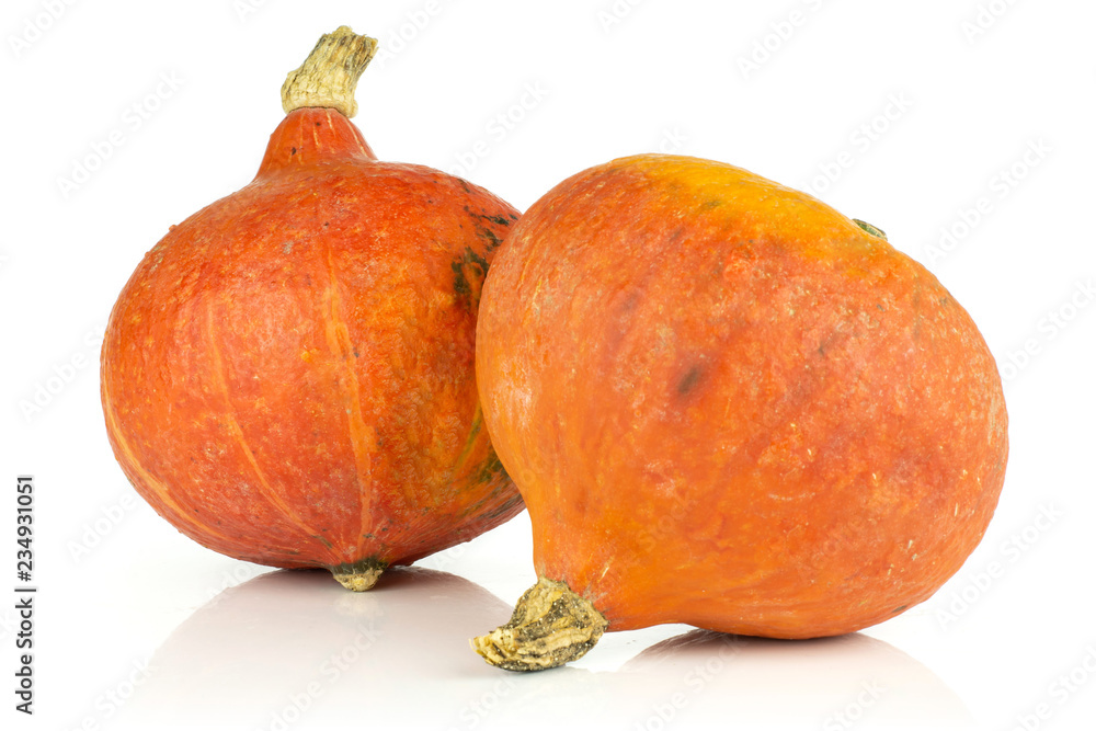 Group of two whole teardrop shaped fresh red kuri pumpkin hokkaido ...