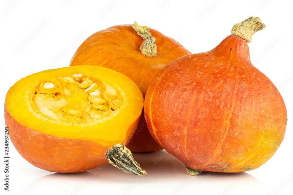 Group of two whole one half of raw fresh red kuri pumpkin hokkaido ...
