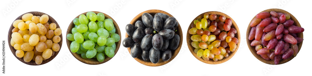 Grapes in a wooden bowl isolated on white background. Top view. Set of ...