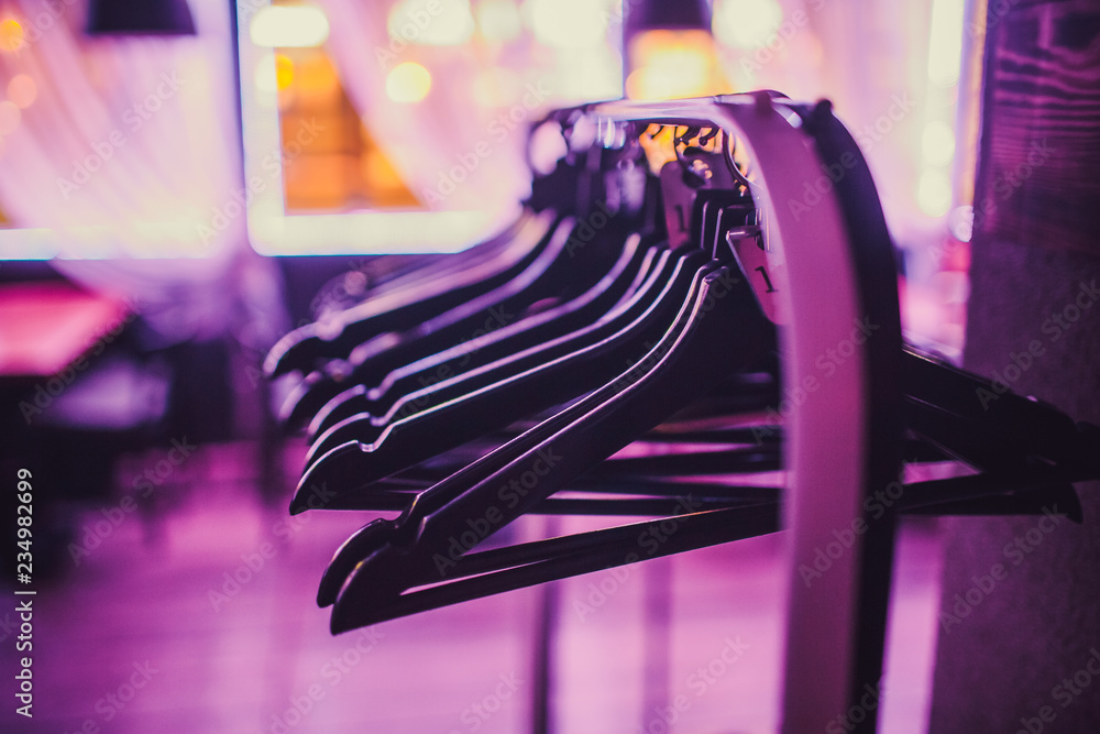 Stock of empty clothes hanger in wardrobe, wooden coat Hangers hanging ...