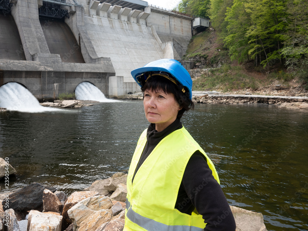 Dam and turbines of a hydroelectric power station with falling water ...