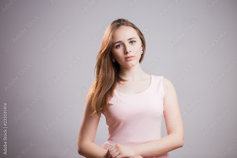 Fotka „Young beautiful sad woman serious and concerned looking into the ...