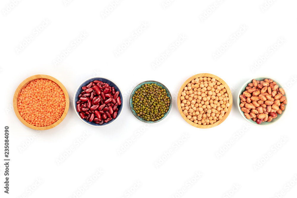 Various types of legumes, shot from above on a white background with ...