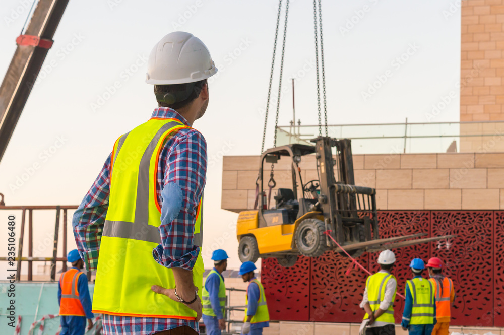 Civil engineer during lifting manoeuvre of a forklift Stock Photo ...
