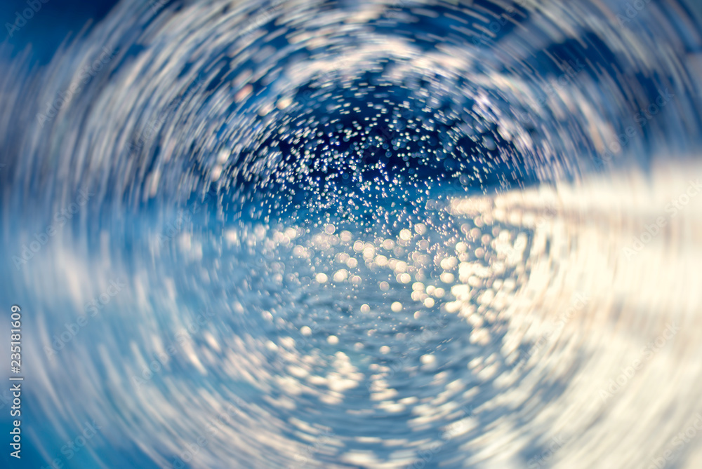 Radial blurred water background. Soft focus bokeh light effects over a ...