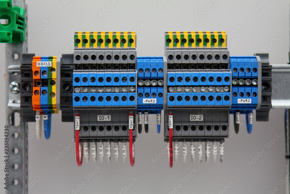 Connecting through-pass electrical terminals in the electrical panel ...