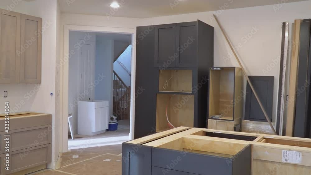 Custom kitchen cabinets in various stages of installation base for ...