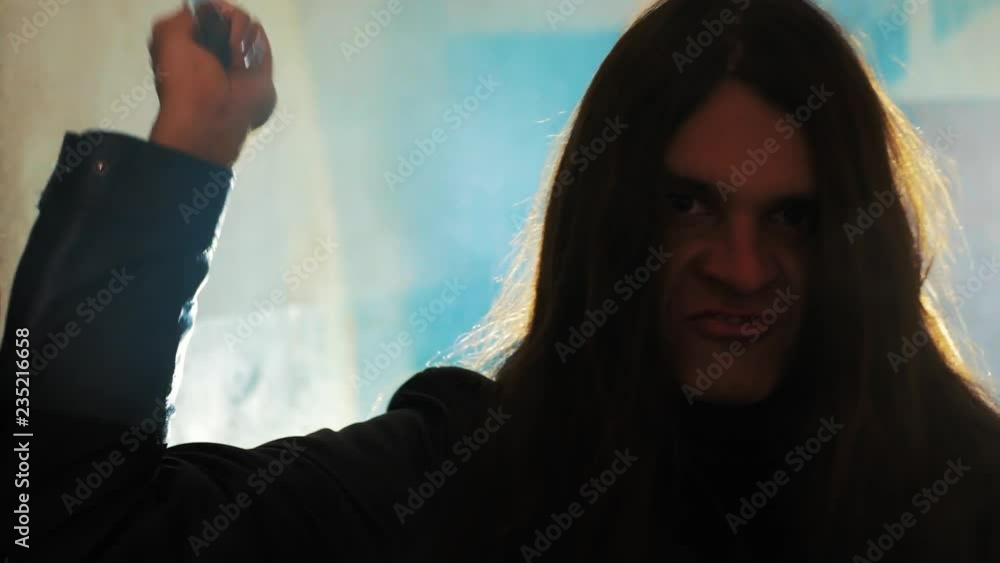 man maniac or killer or horror murderer with knife in hand in dark ...