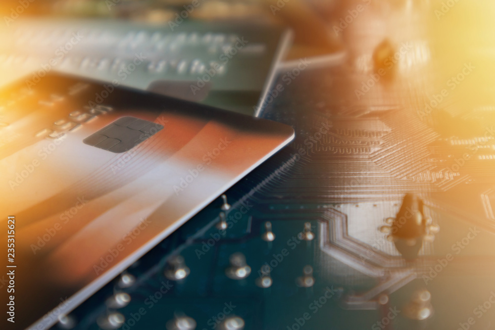 Credit card on circuit Mainboard of computer. Financial and technology ...