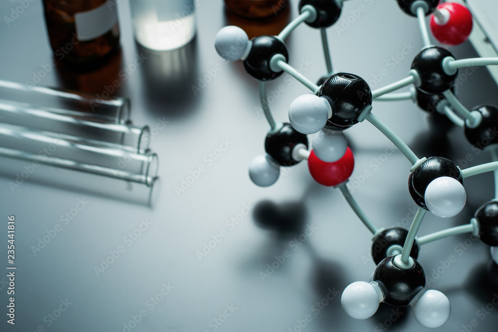 molecular formula and laboratory equipment on a blue background ...