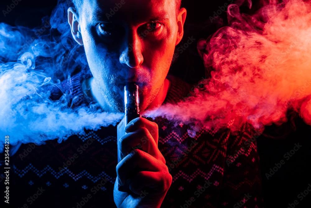 Portrait of a man with a shadow on a serious face with a colored ...