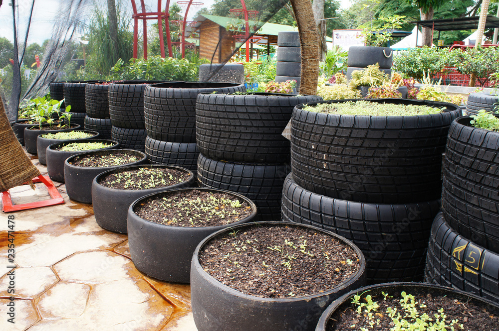 Plant planter box is made from used F1 racing car tires. Used directly ...