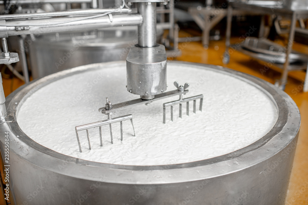 Milk mixing in the stainless tank during the fermentation process at ...