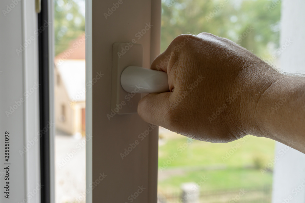 hand opening a window. Ventilating a house in hot weather. Stock Photo ...