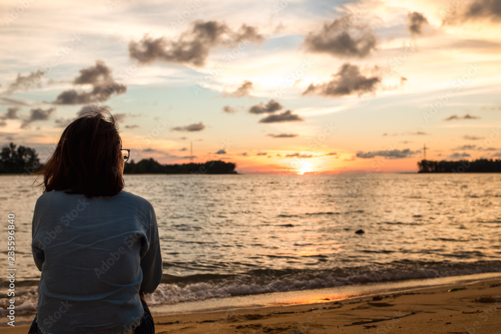 Girl Sitting Alone On Beach