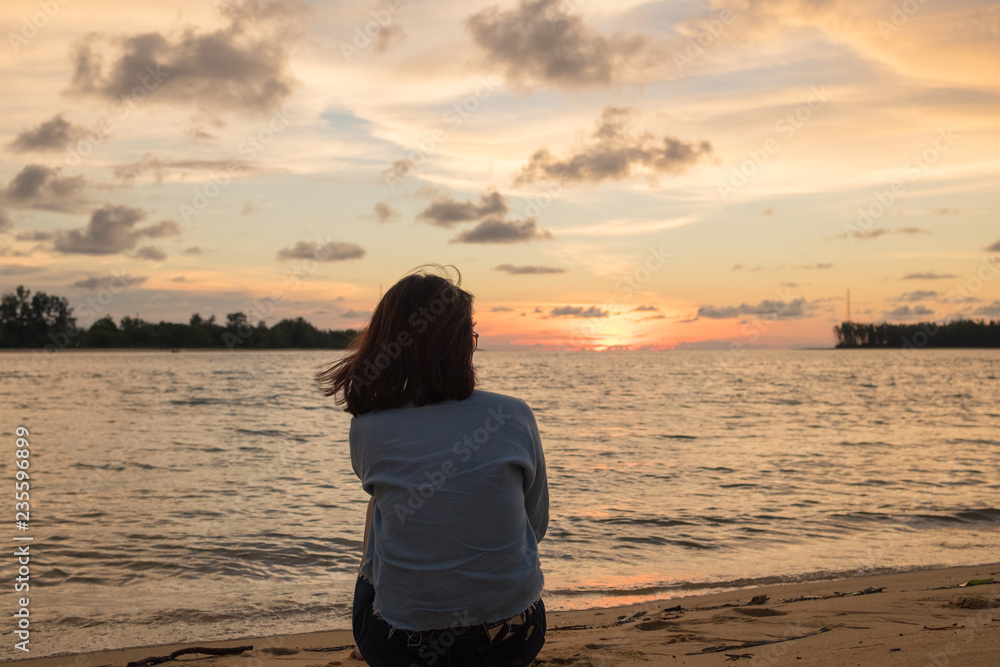 Girl Sitting Alone On Beach