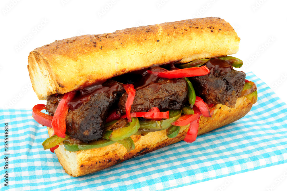 Beef burnt ends and sweet pepper sandwich in a crusty bread baton ...