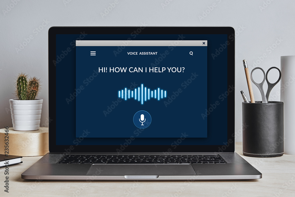 Voice assistant concept on laptop screen on modern desk Stock Photo ...