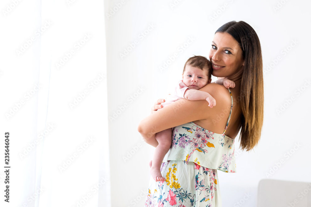 Woman Holding A Baby In Arms