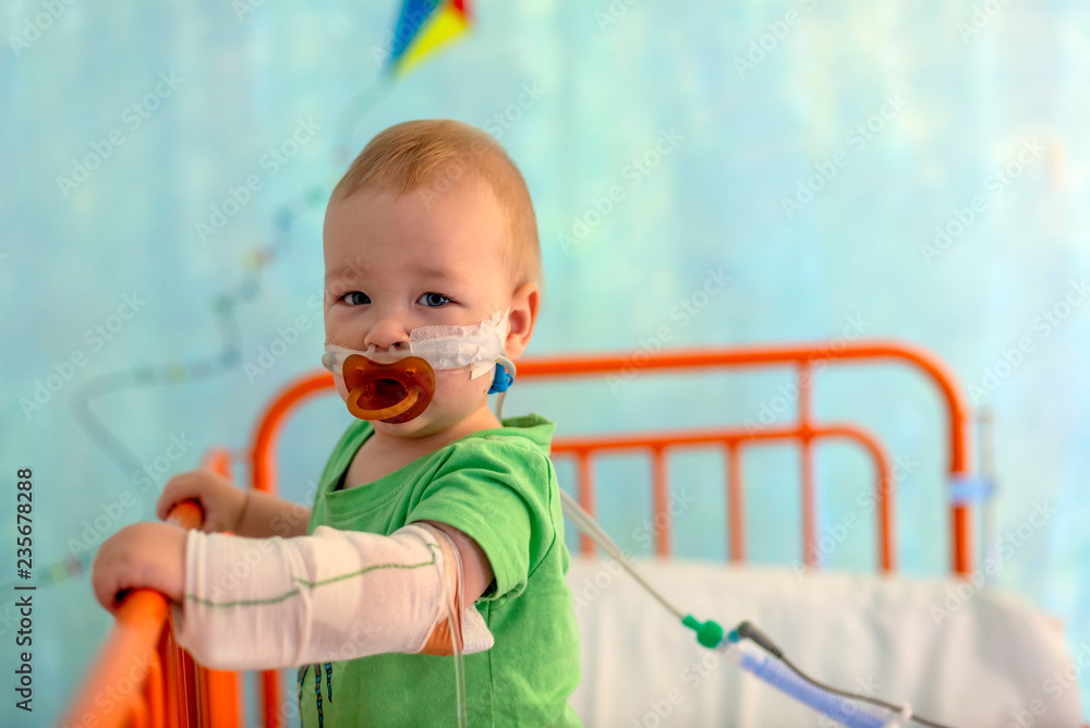 little boy in hospital bed with iv infusions and oxigen Stock Photo ...