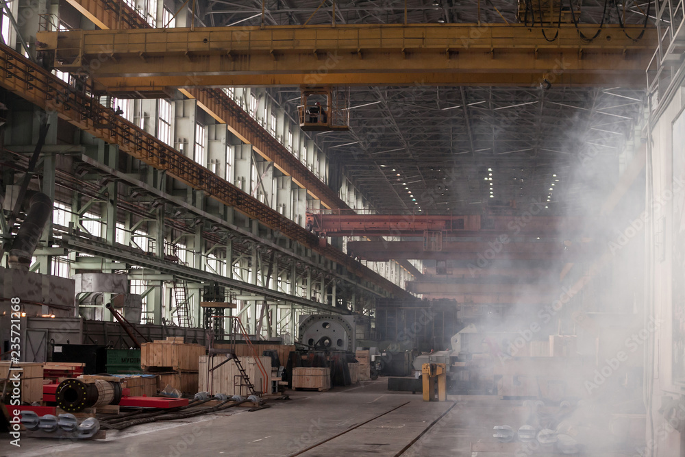 factory bridge crane in an enterprise. Stock Photo | Adobe Stock