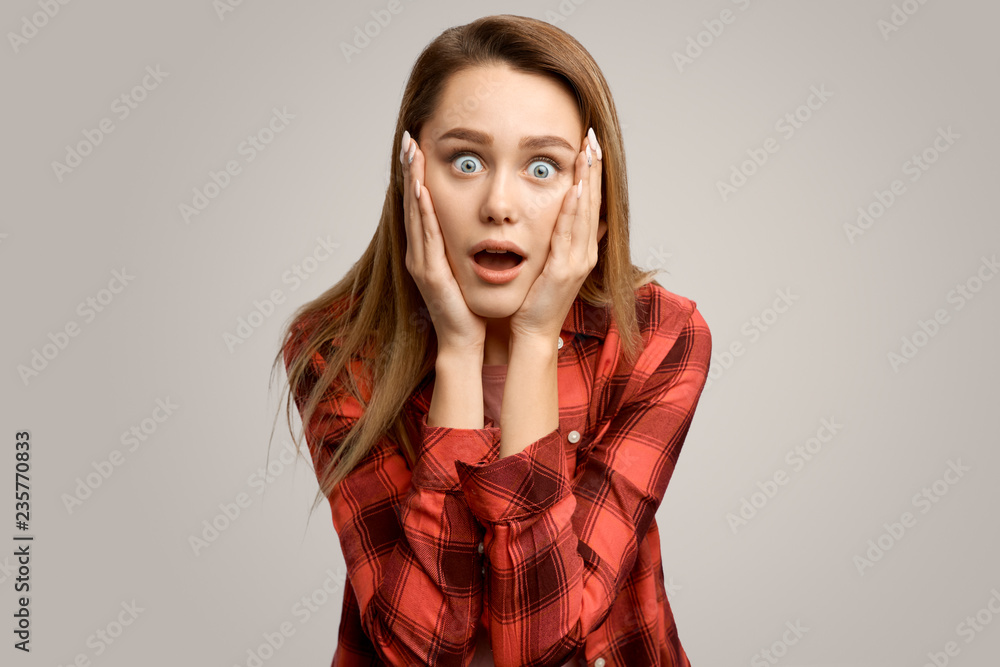 Shocked surprised female being scared by someone, looks horrified ...