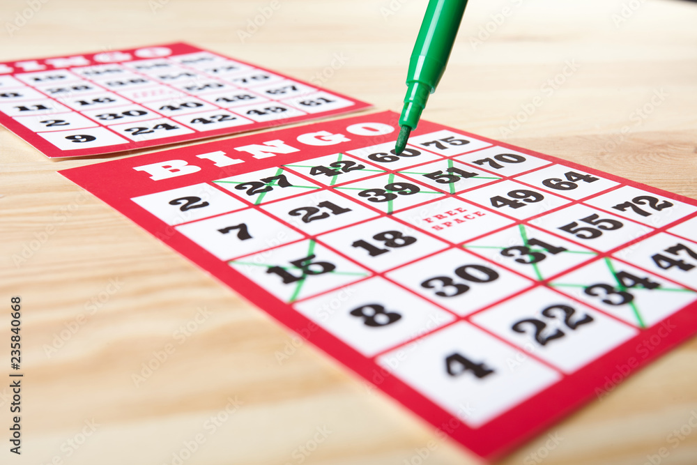 hand-marking-bingo-winning-numbers-stock-photo-adobe-stock