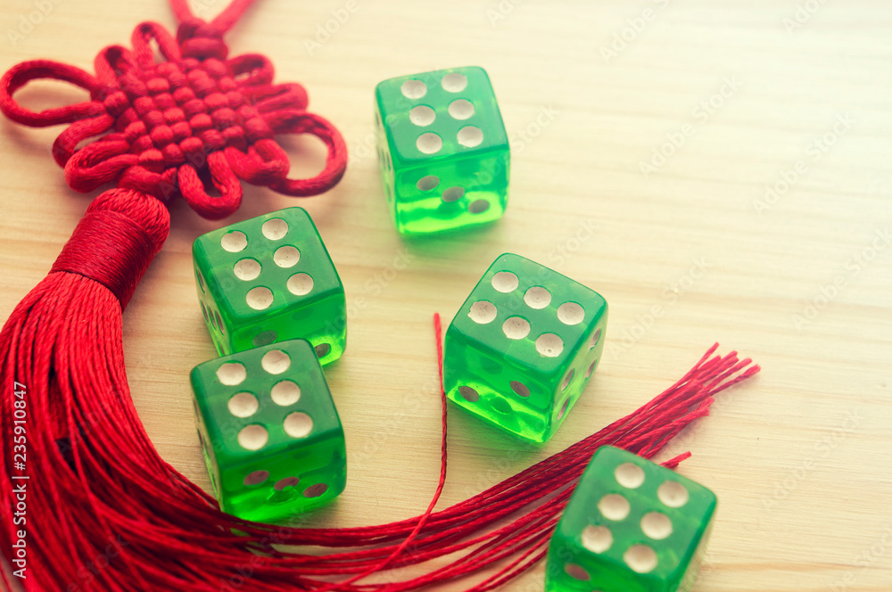 A red Chinese Good Luck Symbol - Mystic Knot and dices showing number ...