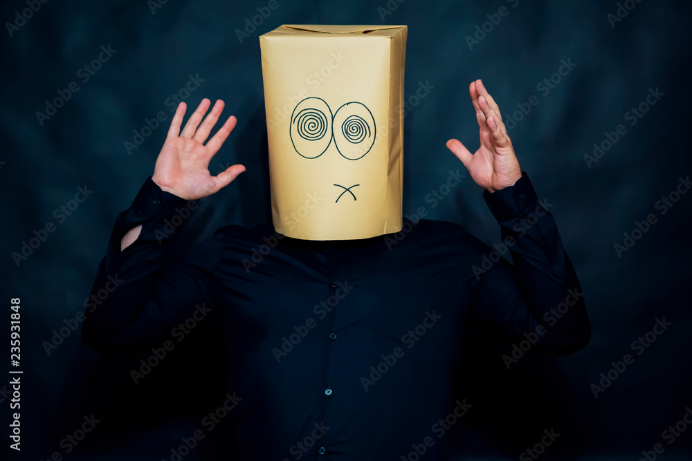 Emotion concept. The man. Hands raised at head level.On the face is an ...