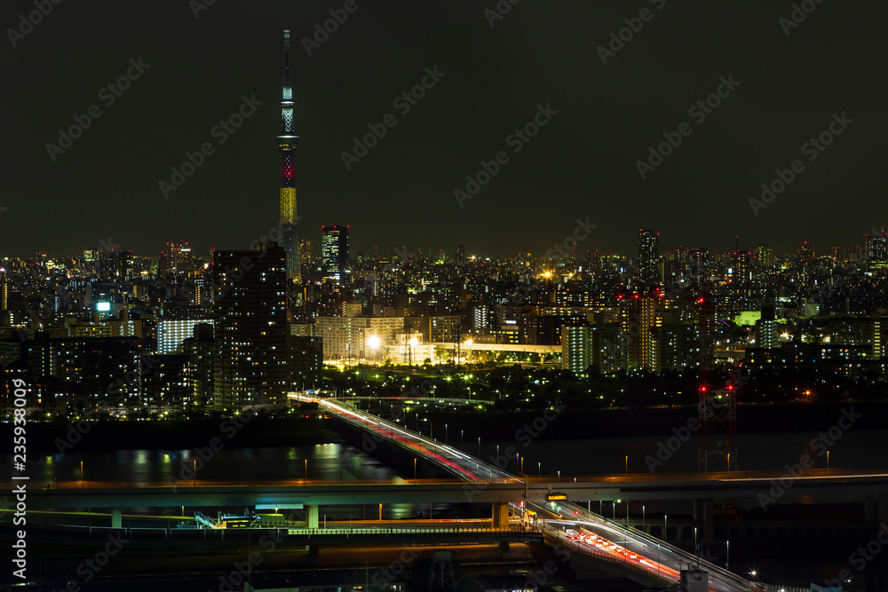 Tokyo skytree tower in Janpan in night light with brigde and building ...