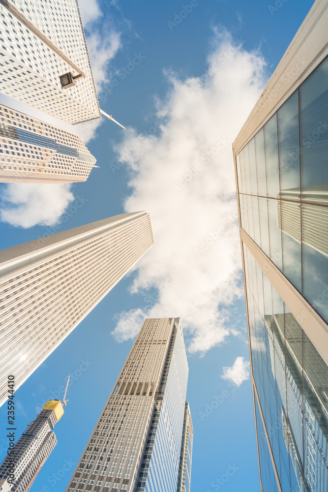 Low angle view of Chicago skylines and reflection on steel metal ...